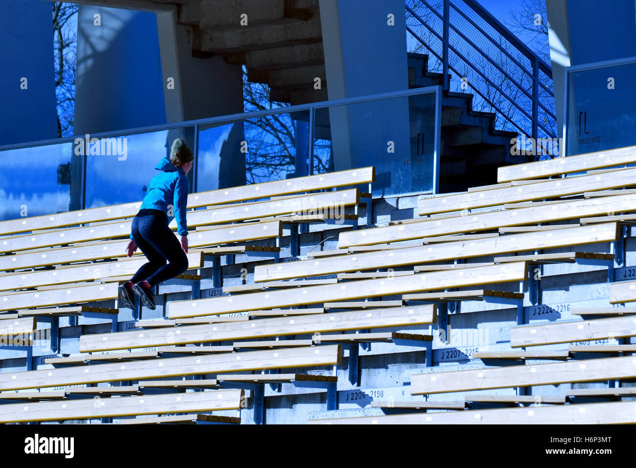Jump training. Young woman training jumping on stairs Stock Photo - Alamy