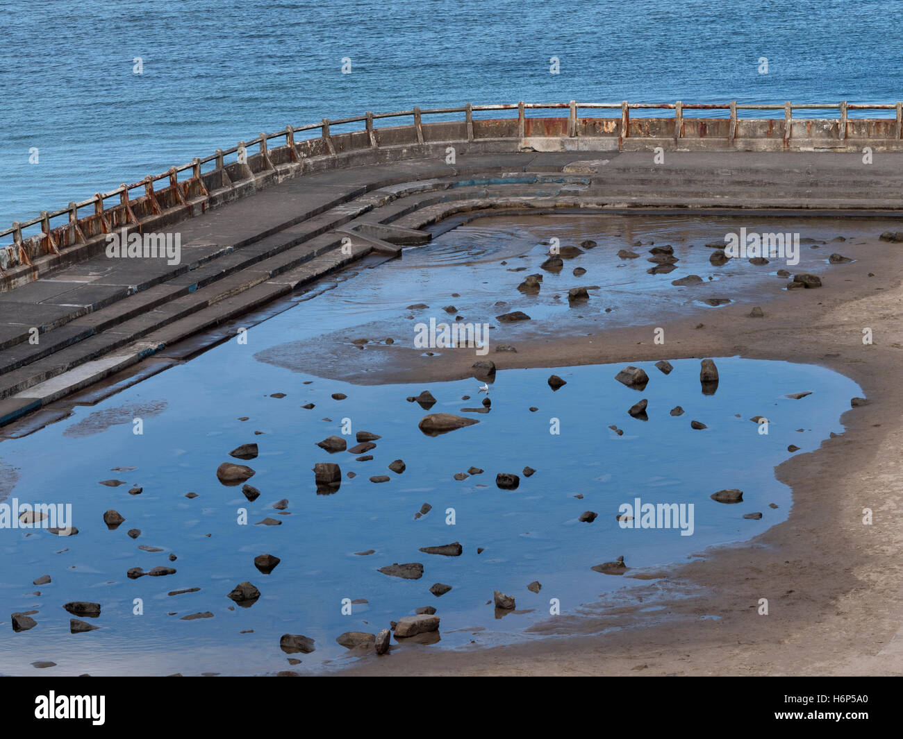 Disused abandoned coastal open air swimming pool, at Tynemouth, North ...