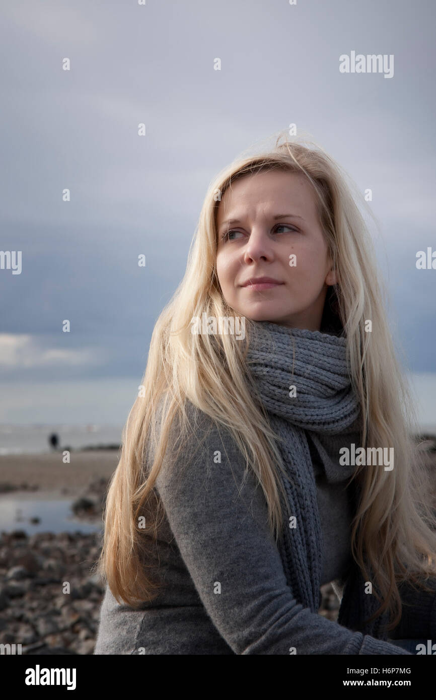 Teens sitting beach waves hi-res stock photography and images - Alamy