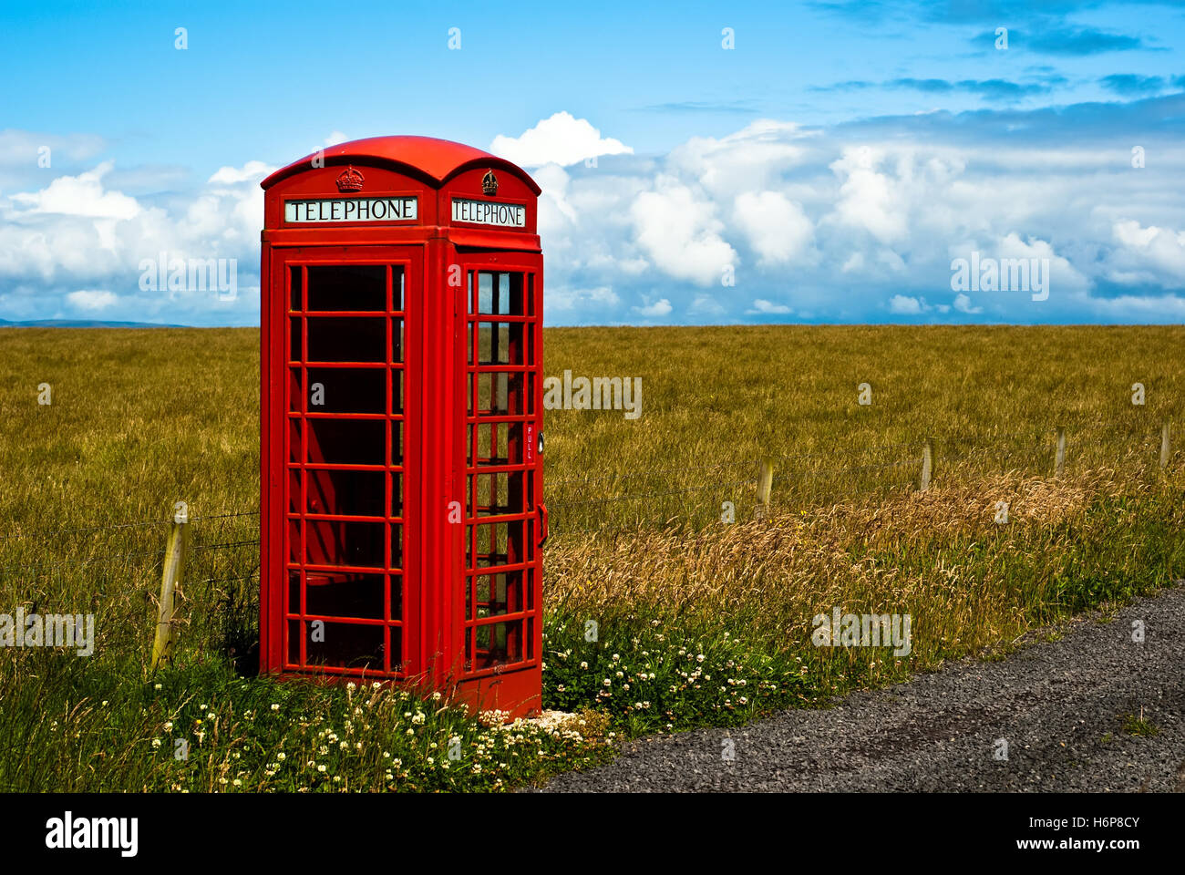 red telephone box isolated in the landscape v1 Stock Photo - Alamy