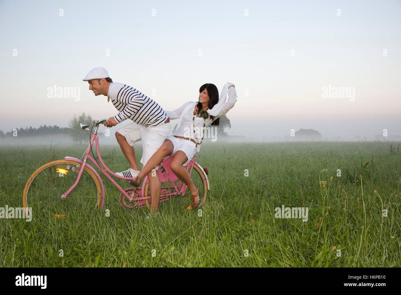 couple on bike Stock Photo - Alamy