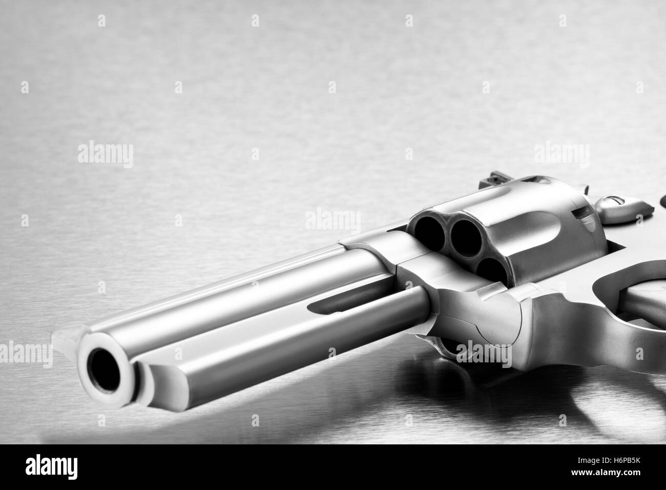 silver pistol arm weapon revolver gun firearm grey gray object closeup ...