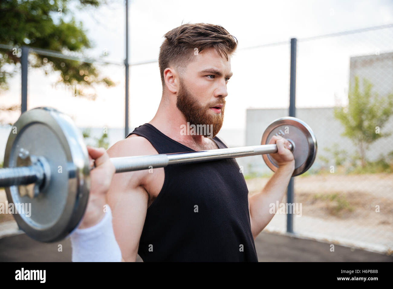 Closeup muscular young man lifting hi-res stock photography and images ...