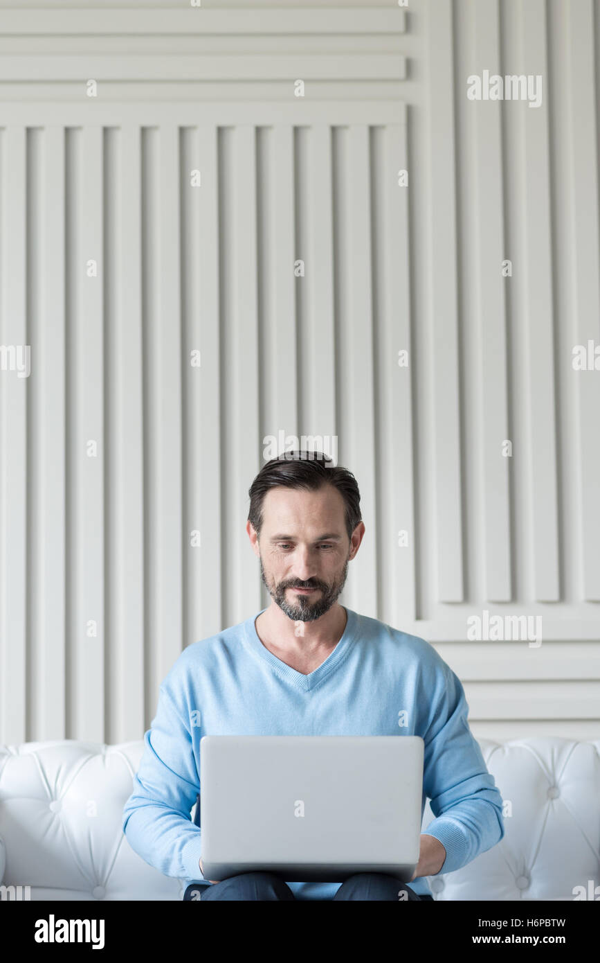 Hard working pleasant man concentrating on his work Stock Photo - Alamy