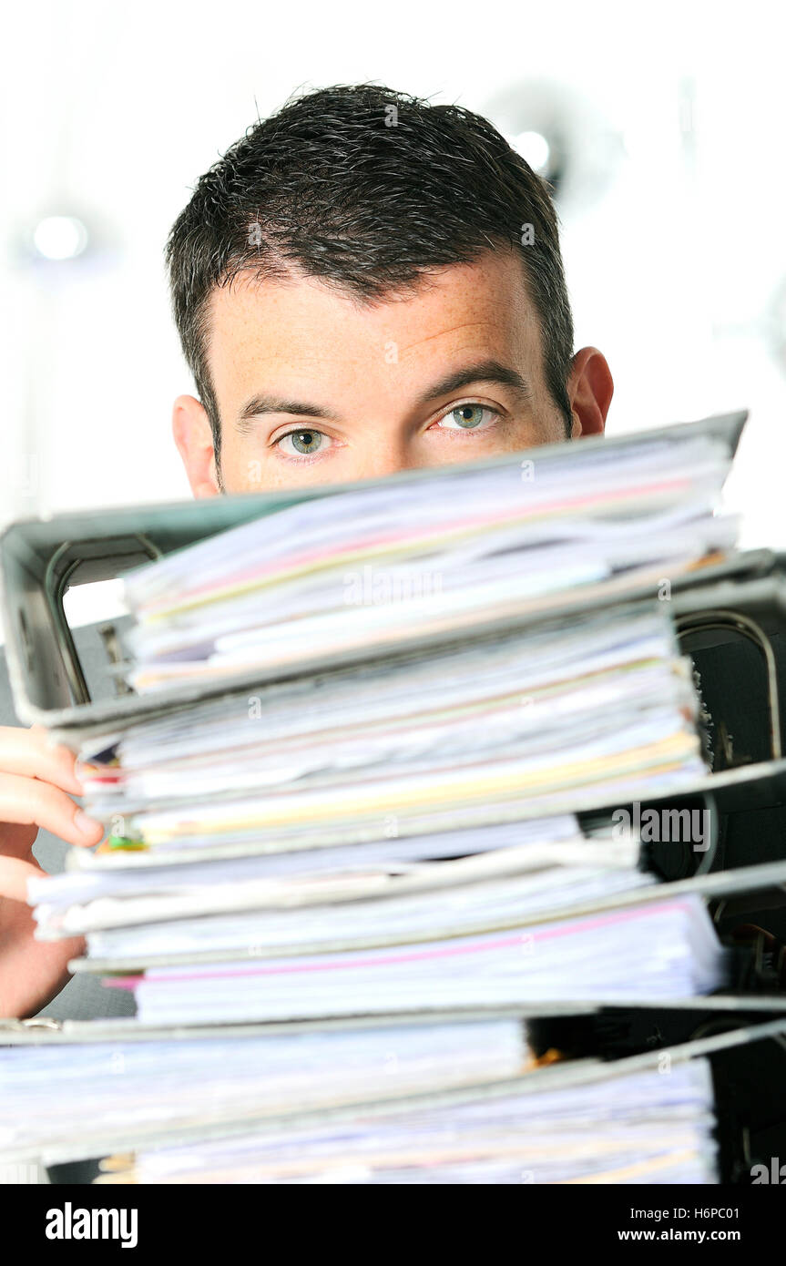 Hidden behind paperwork hi-res stock photography and images - Alamy