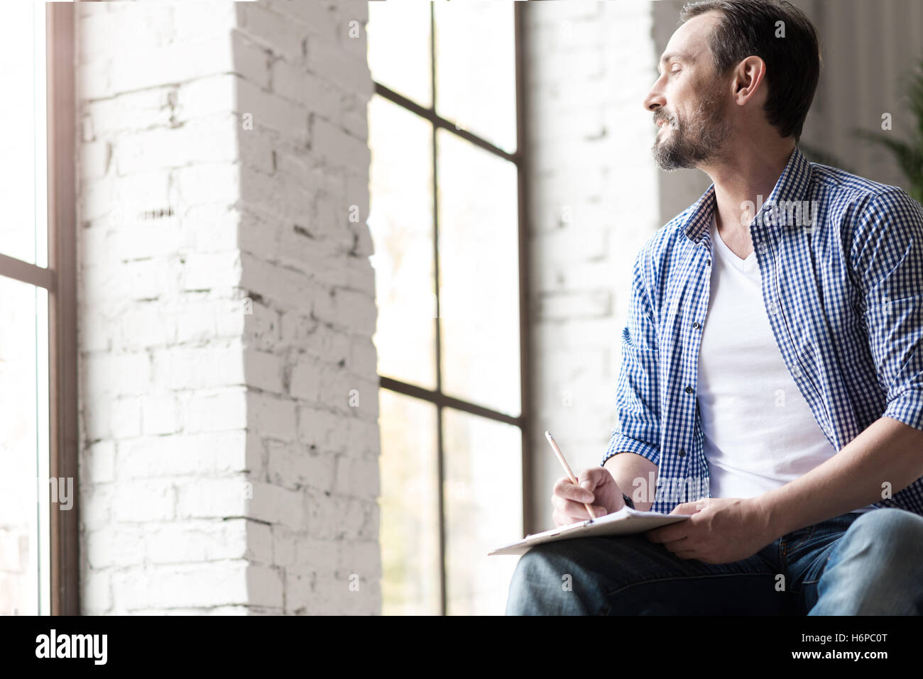 Good looking talented man drawing a picture Stock Photo - Alamy