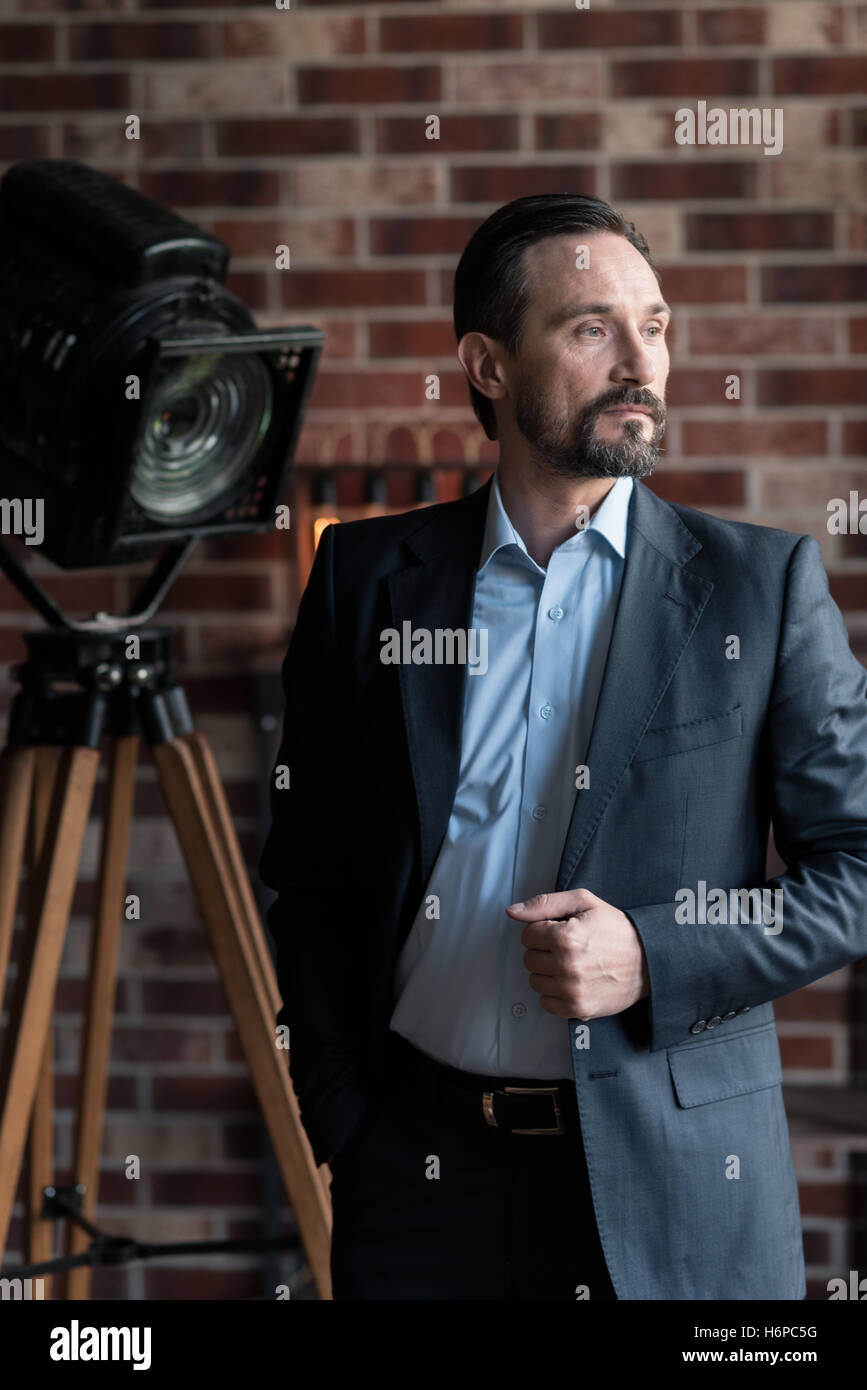 Good looking successful businessman standing near the searchlight Stock ...