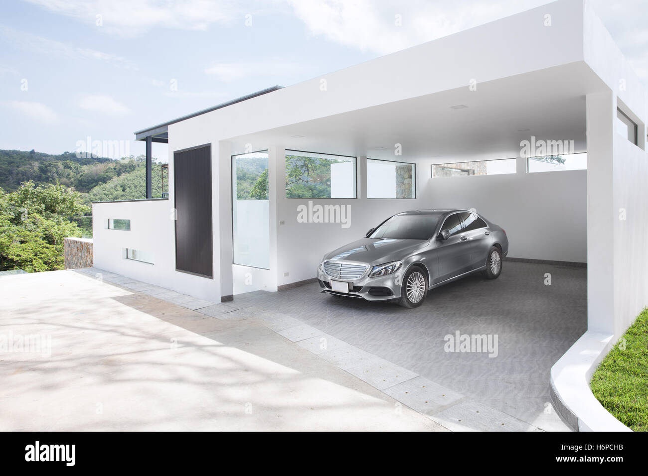 panoramic view of white concrete garage with automobile in it Stock ...