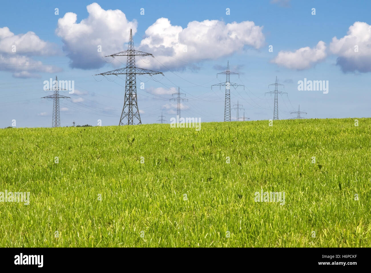 pylons on meadow Stock Photo - Alamy