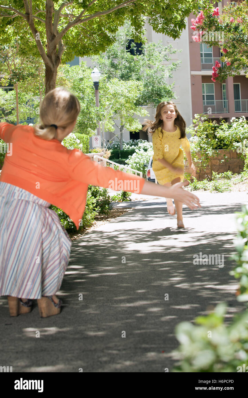 portrait of happy mother with daughter having good time in summer ...