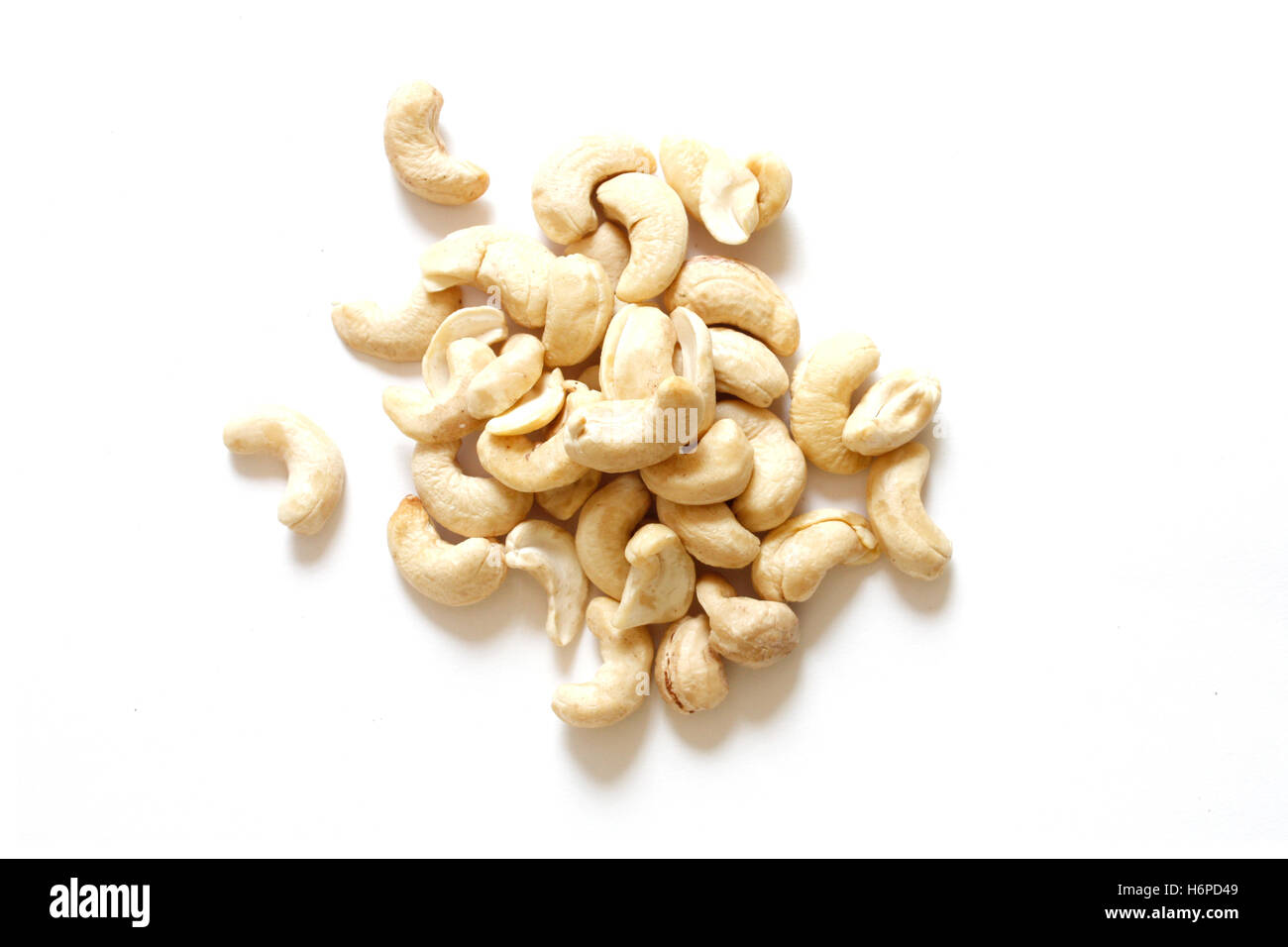 some several a few isolated nuts heap unsalted pile backdrop background ...