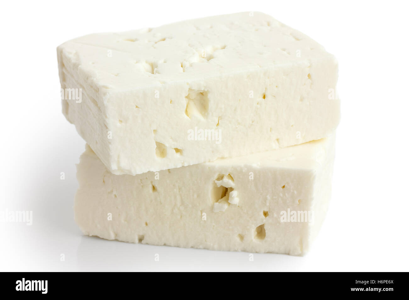 Greek feta cheese block isolated on white Stock Photo - Alamy