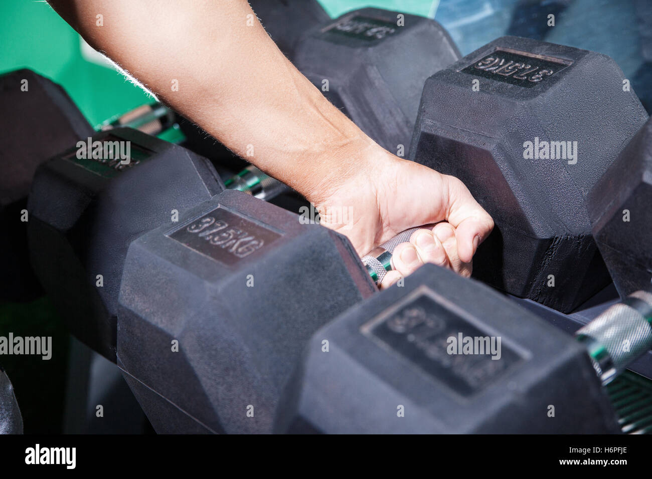 Holding up heavy weight hi-res stock photography and images - Alamy