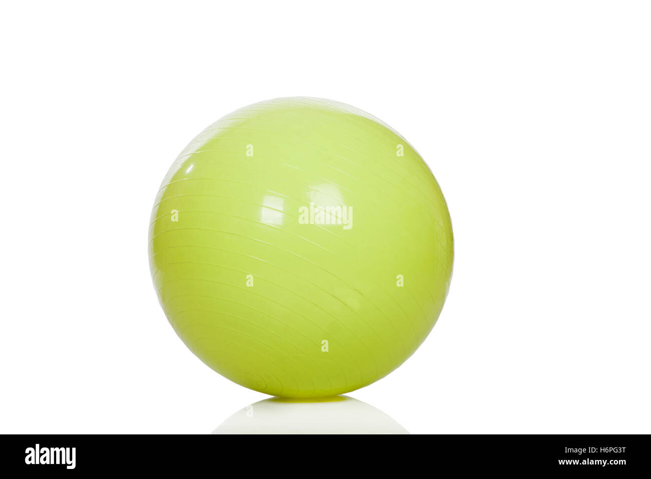 Big green training ball isolated on a white background Stock Photo - Alamy
