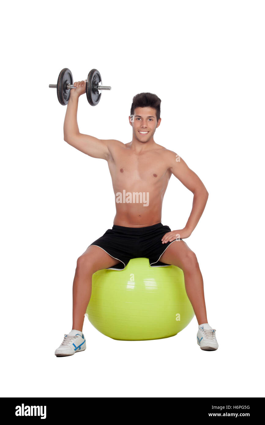 Strong man practicing exercises with dumbbells sit on a ball isolated ...