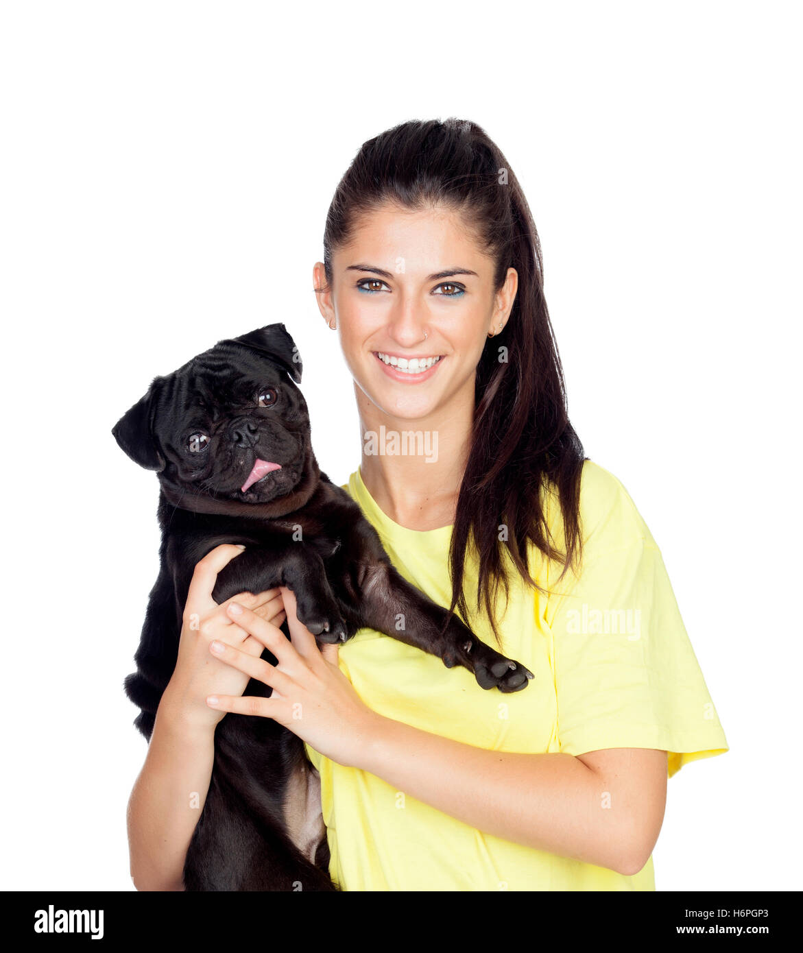 Brunette girl with her pug dog isolated on white background Stock Photo ...