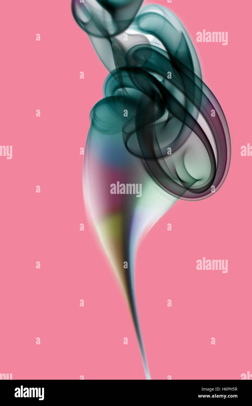 Abstract smoke shapes over a pink background Stock Photo - Alamy