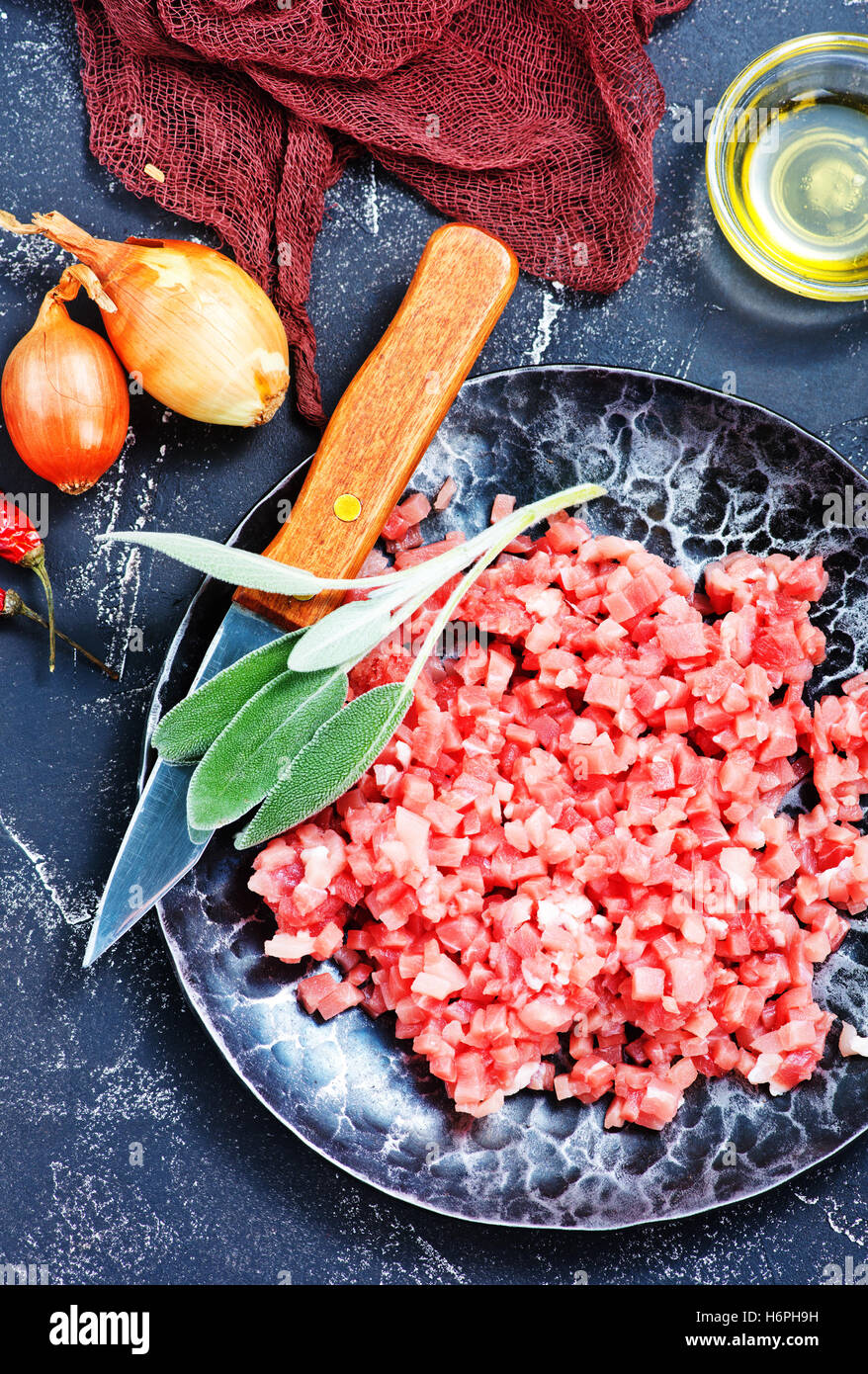 minced meat on plate and on a table Stock Photo - Alamy