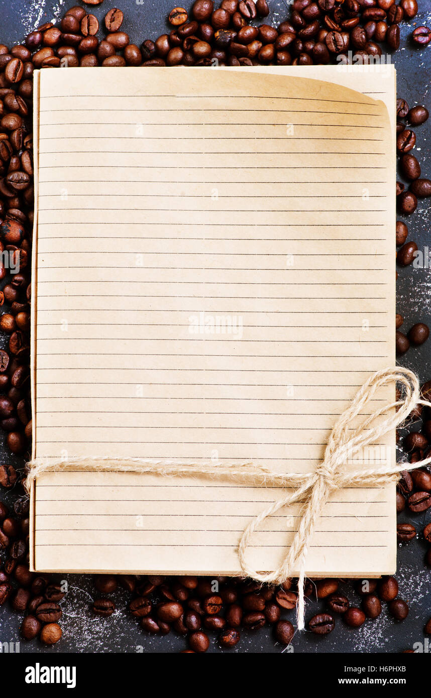 coffee beans and note on a table Stock Photo - Alamy
