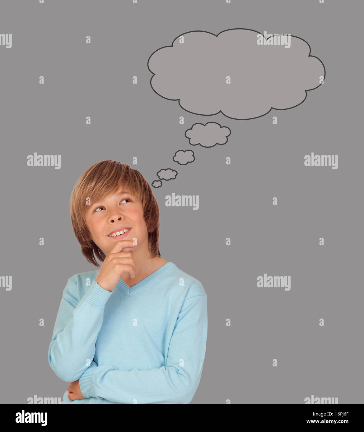 Doubtful preteen boy thinking on gray background Stock Photo - Alamy