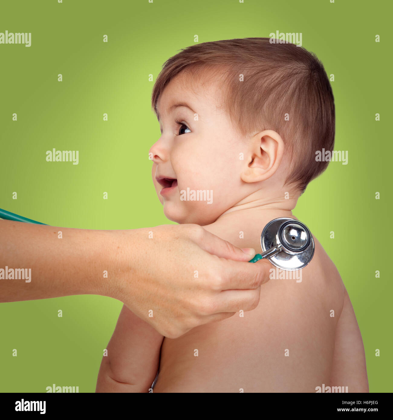 Adorable baby at the doctor's office for a pediatric examination on a ...