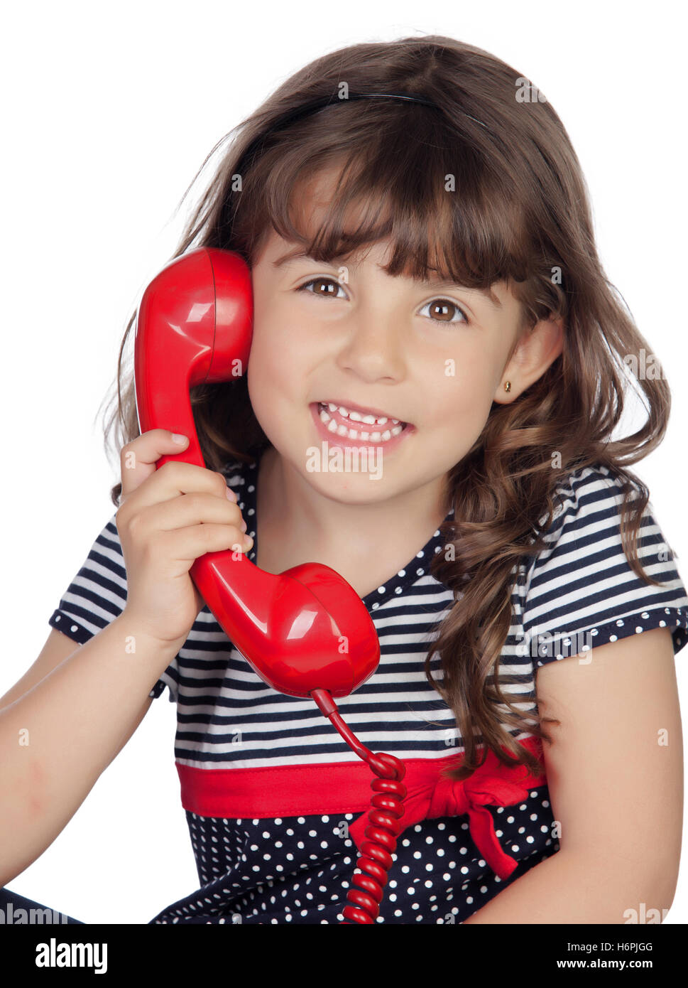Adorable little girl wiht red phone isolated on white background Stock ...