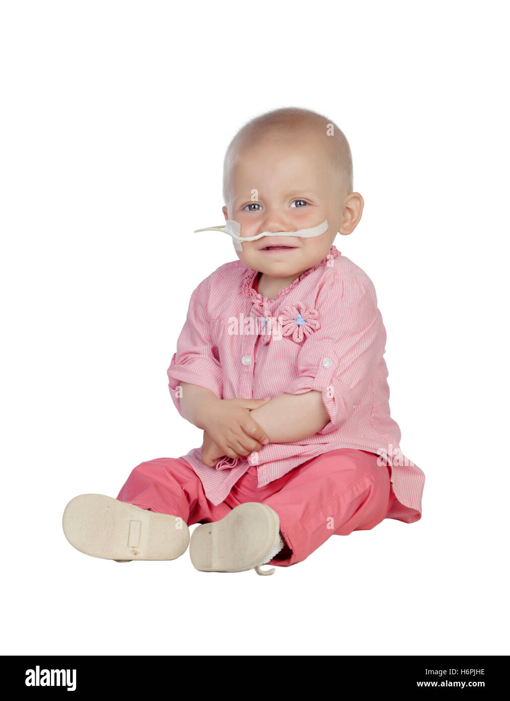 Adorable baby without hair beating the disease isolated on white ...