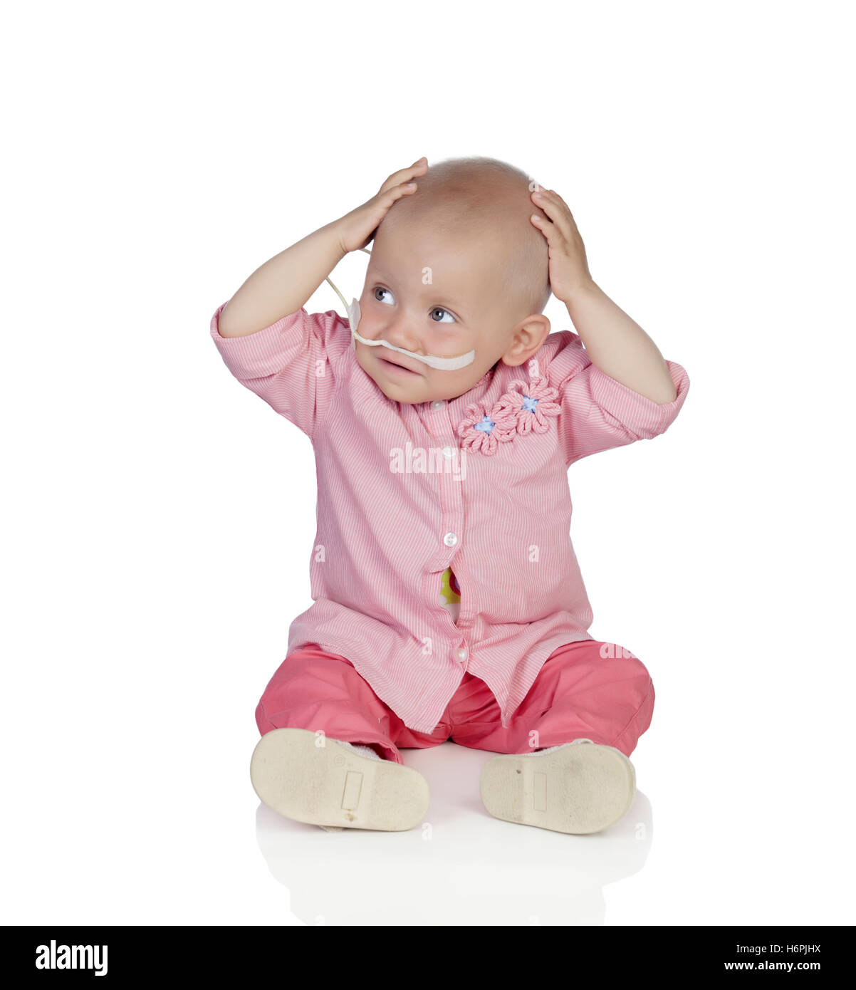 Adorable baby without hair beating the disease isolated on white ...