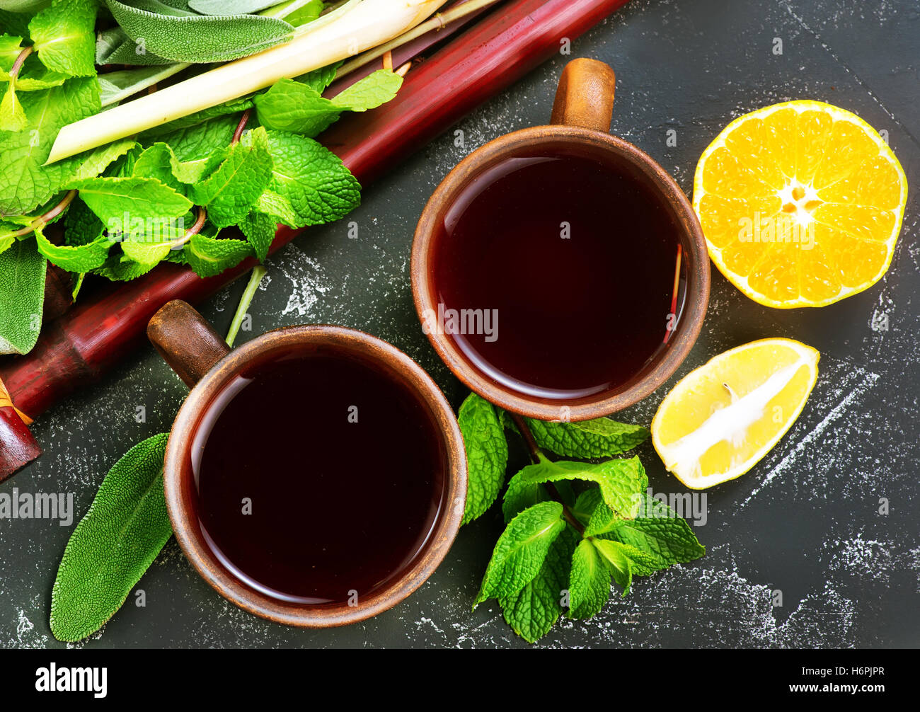 fresh tea in cups and on a table Stock Photo - Alamy