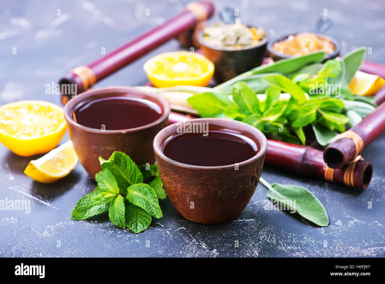 fresh tea in cups and on a table Stock Photo - Alamy