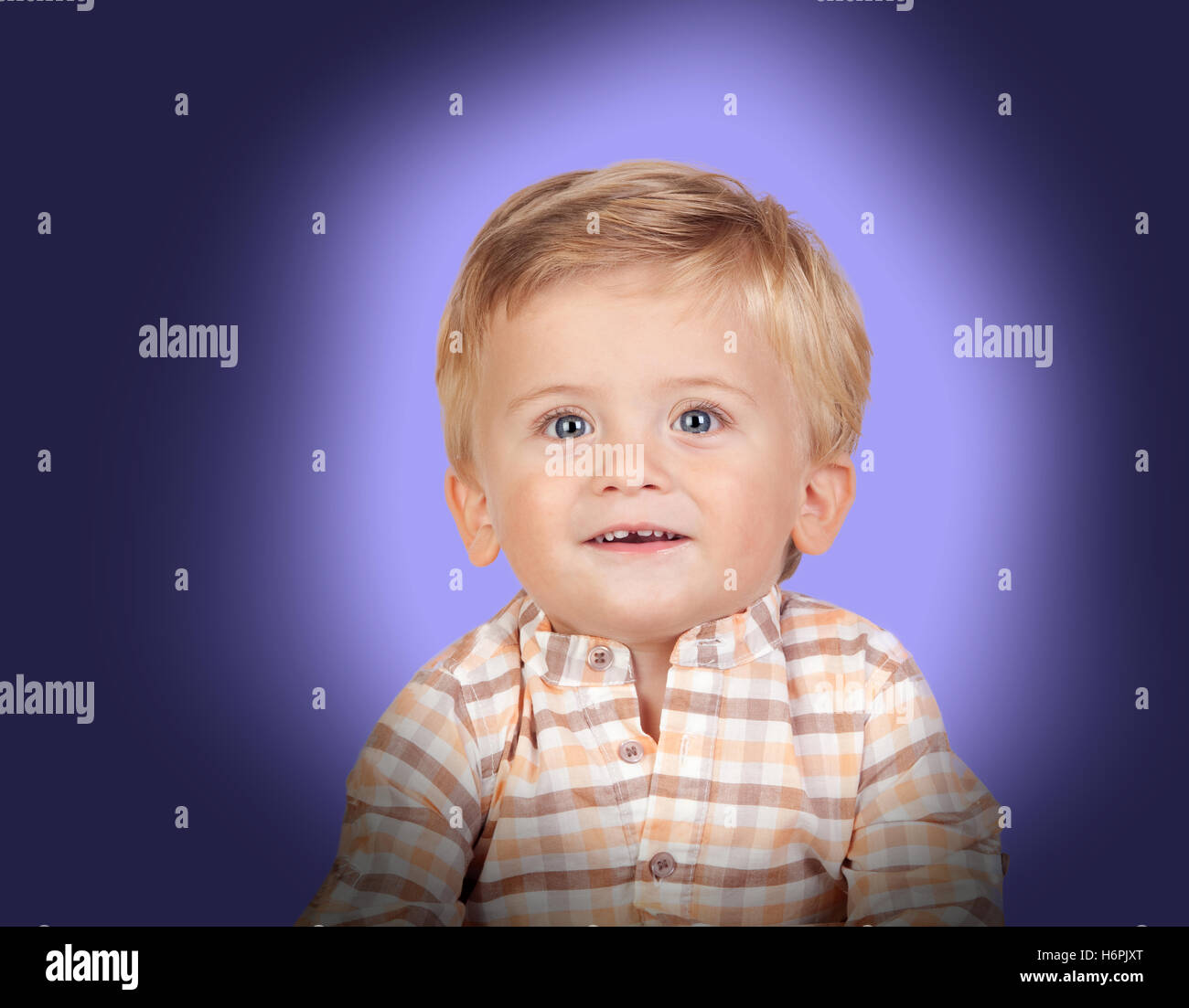 Adorable baby with plaid shirt on blue background Stock Photo - Alamy