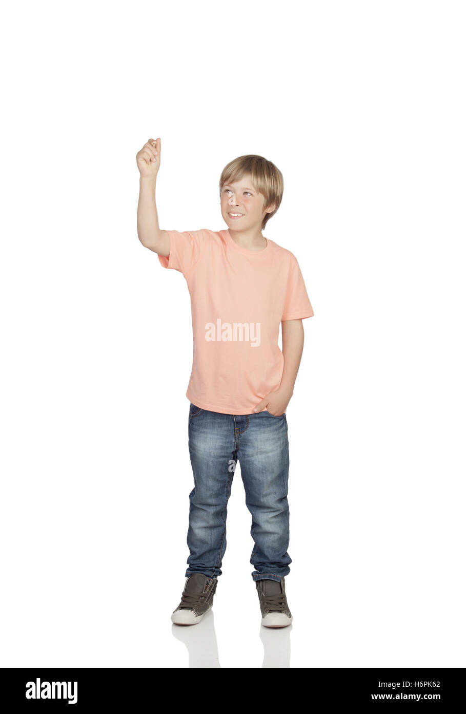 Smiling boy raising his arm holding something isolated on white ...