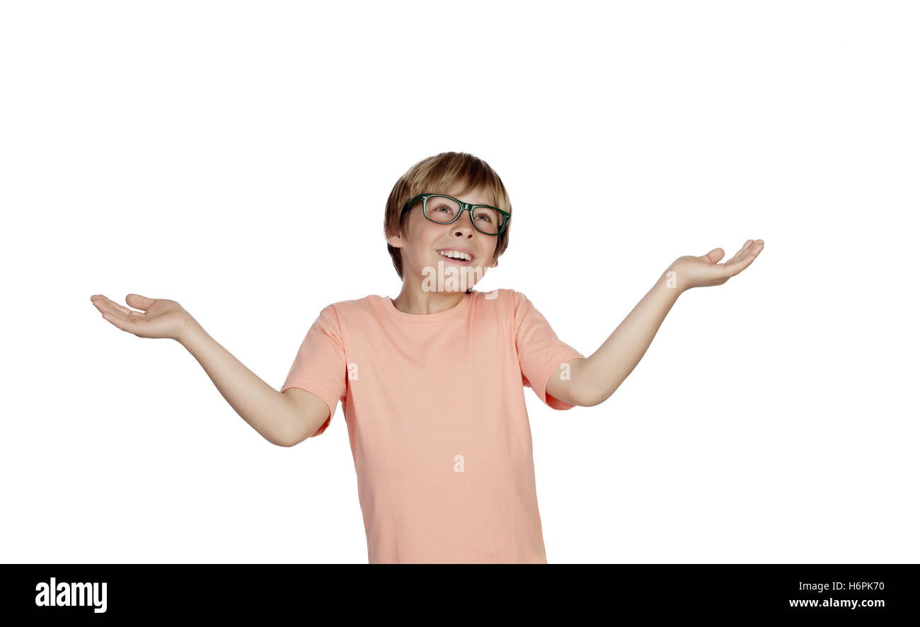 Smiling boy with a doubtful expression isolated on a white background ...
