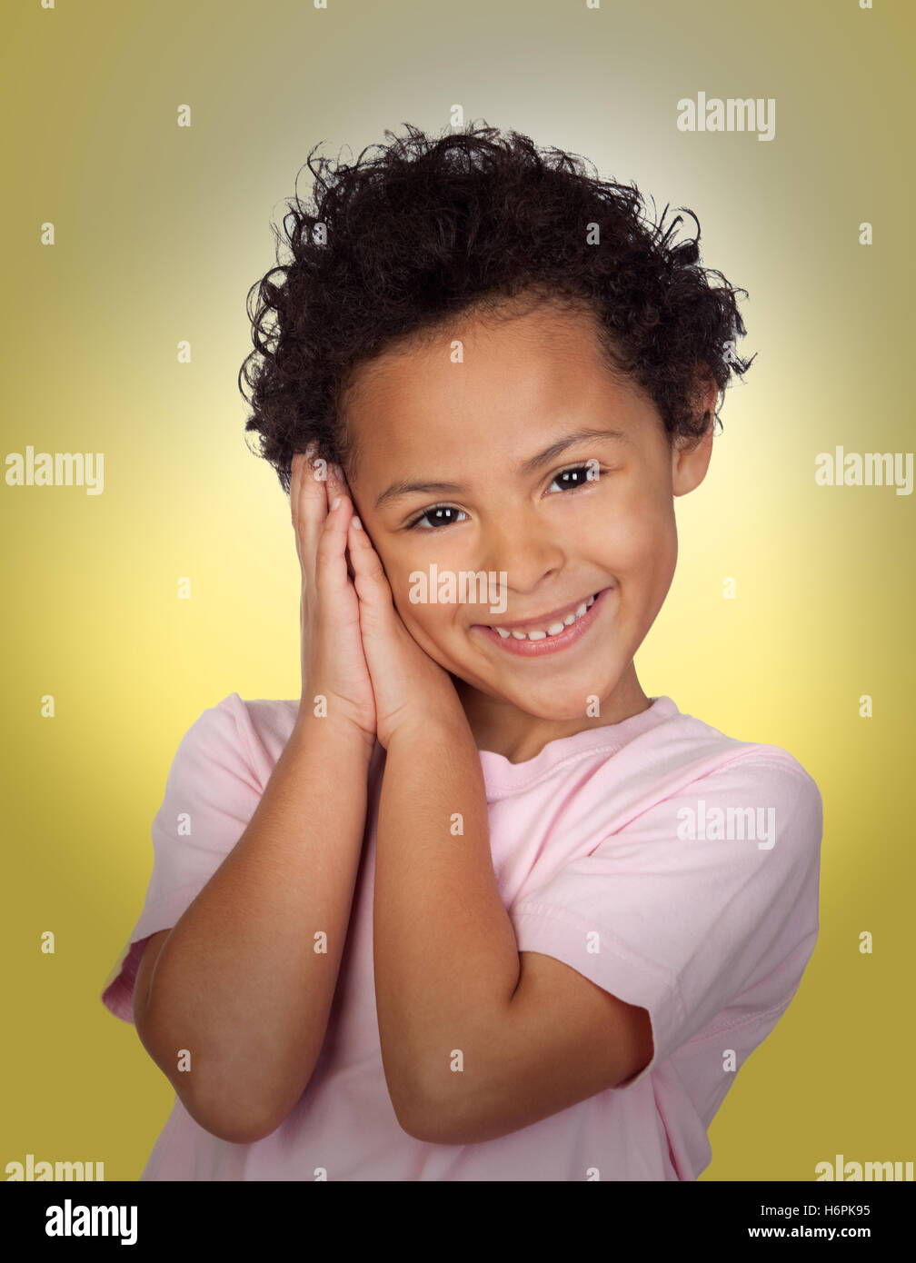Happy latin child making the gesture of sleep with a yellow background ...
