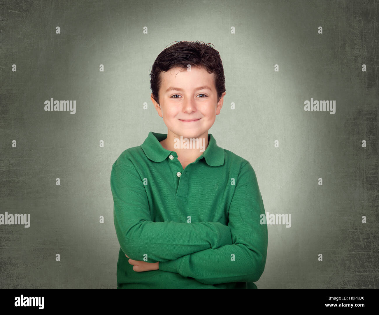Portrait of adorable child on a over gray and irregular background ...