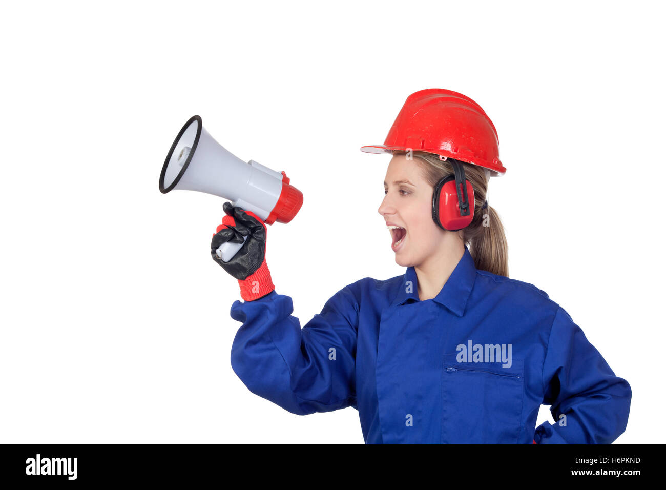 Industrial worker woman with a megaphone isolated on white background ...