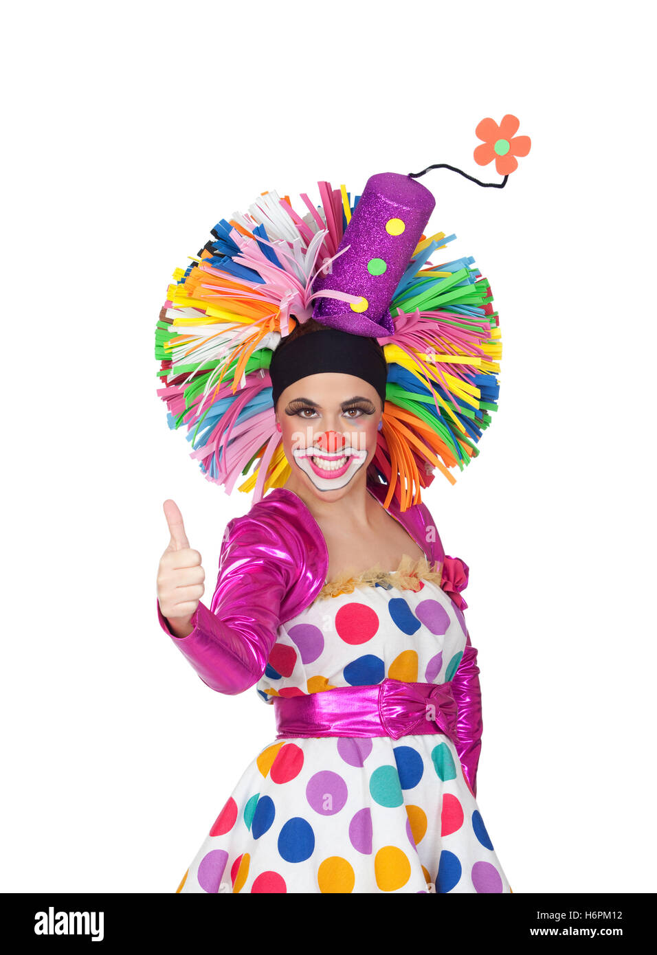 Funny girl clown with a big colorful wig saying Ok isolated on white ...