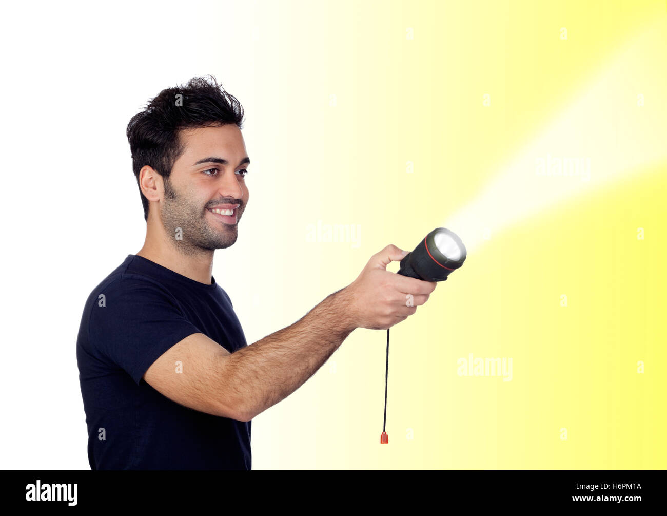 Attractive men in black with a flashlight looking for something on ...