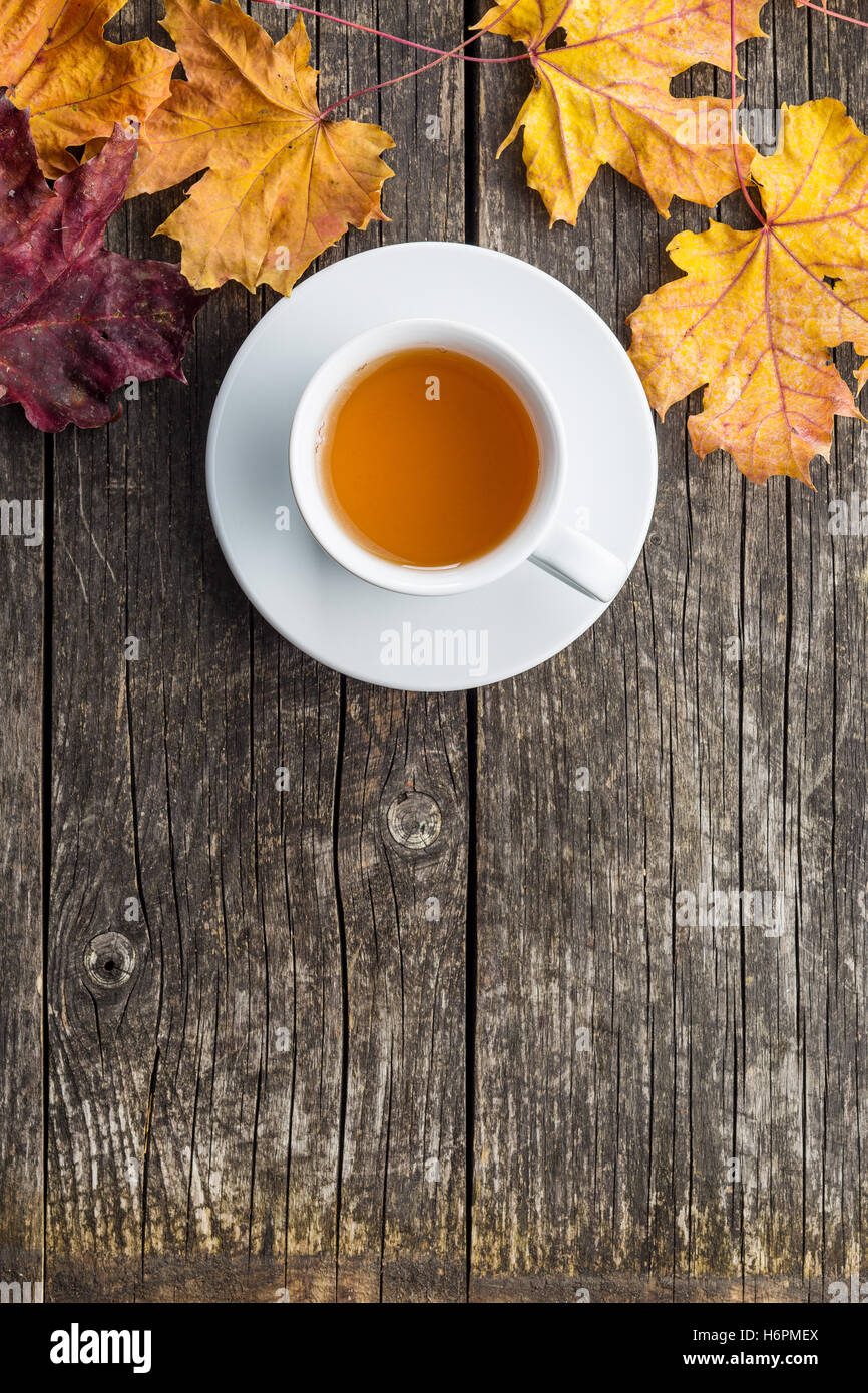 Cup of tea with autumn leaves. Top view Stock Photo - Alamy