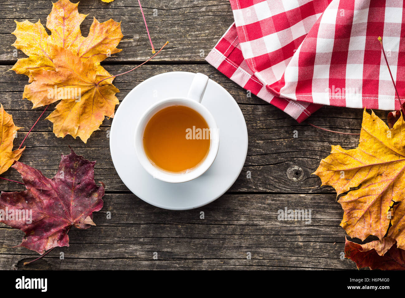Cup of tea with autumn leaves. Top view Stock Photo - Alamy