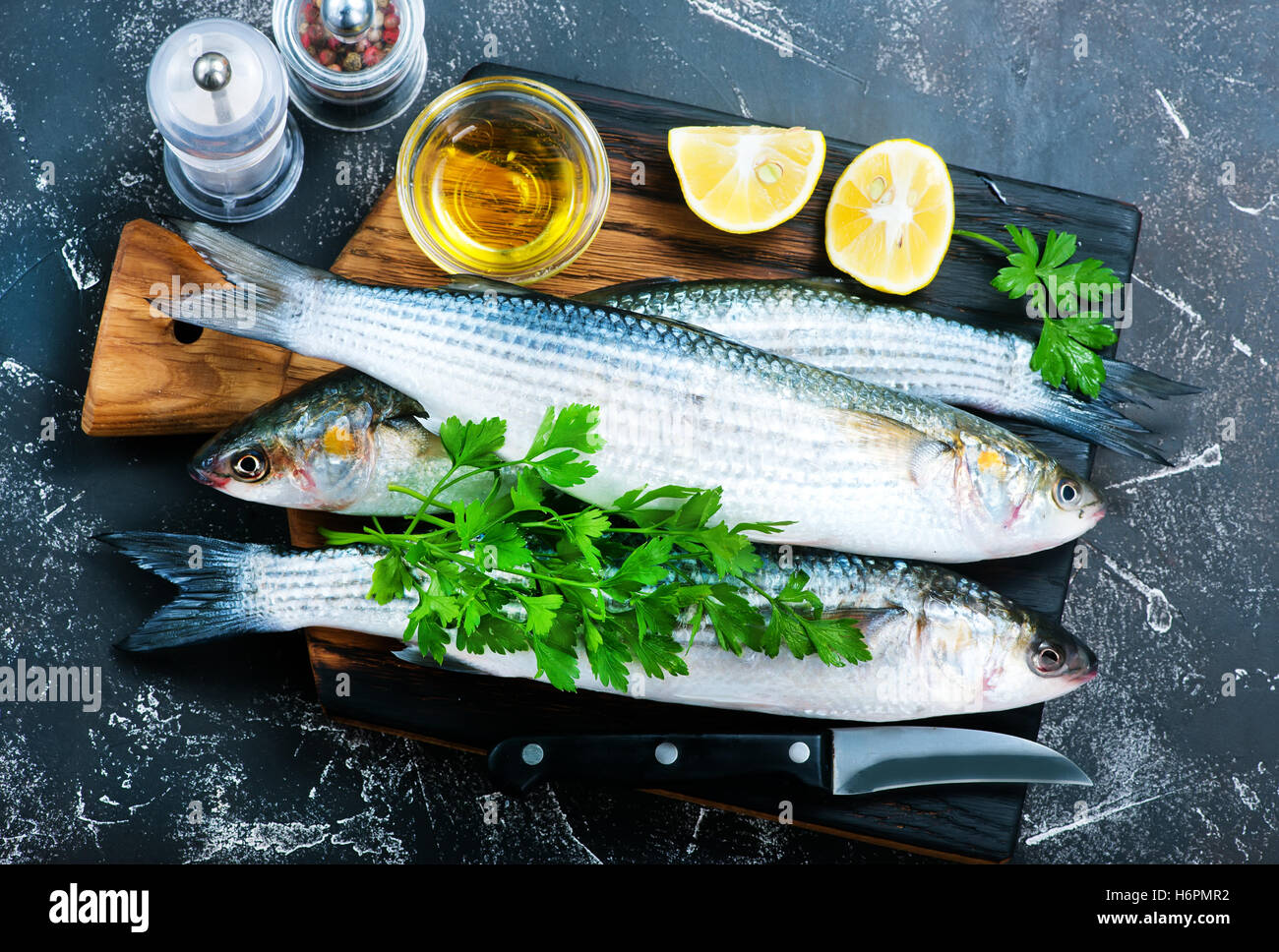 raw fish with aroma spice on a table Stock Photo - Alamy