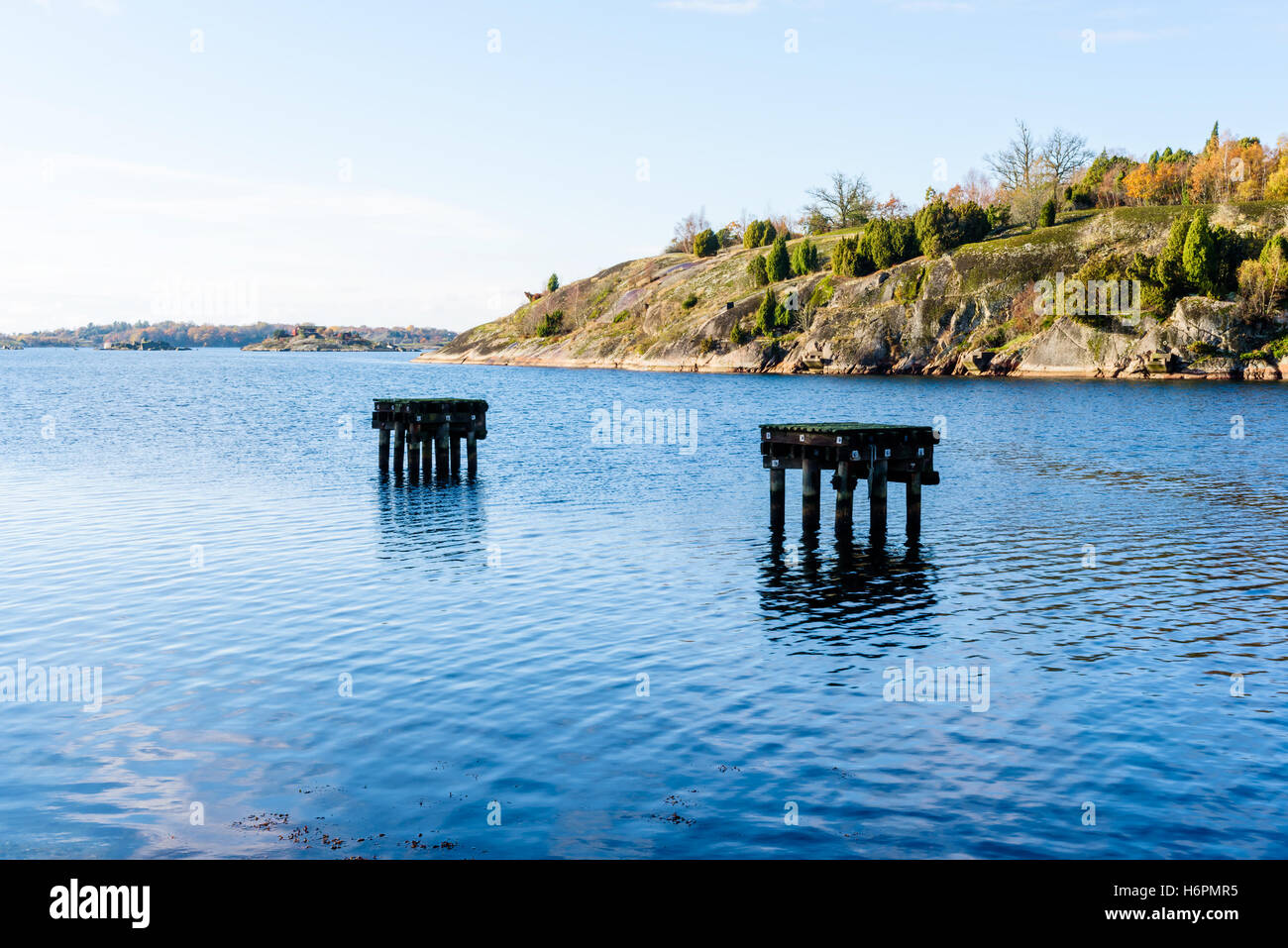 Mooring place with granite cliff in coastal landscape. Jarnavik in ...