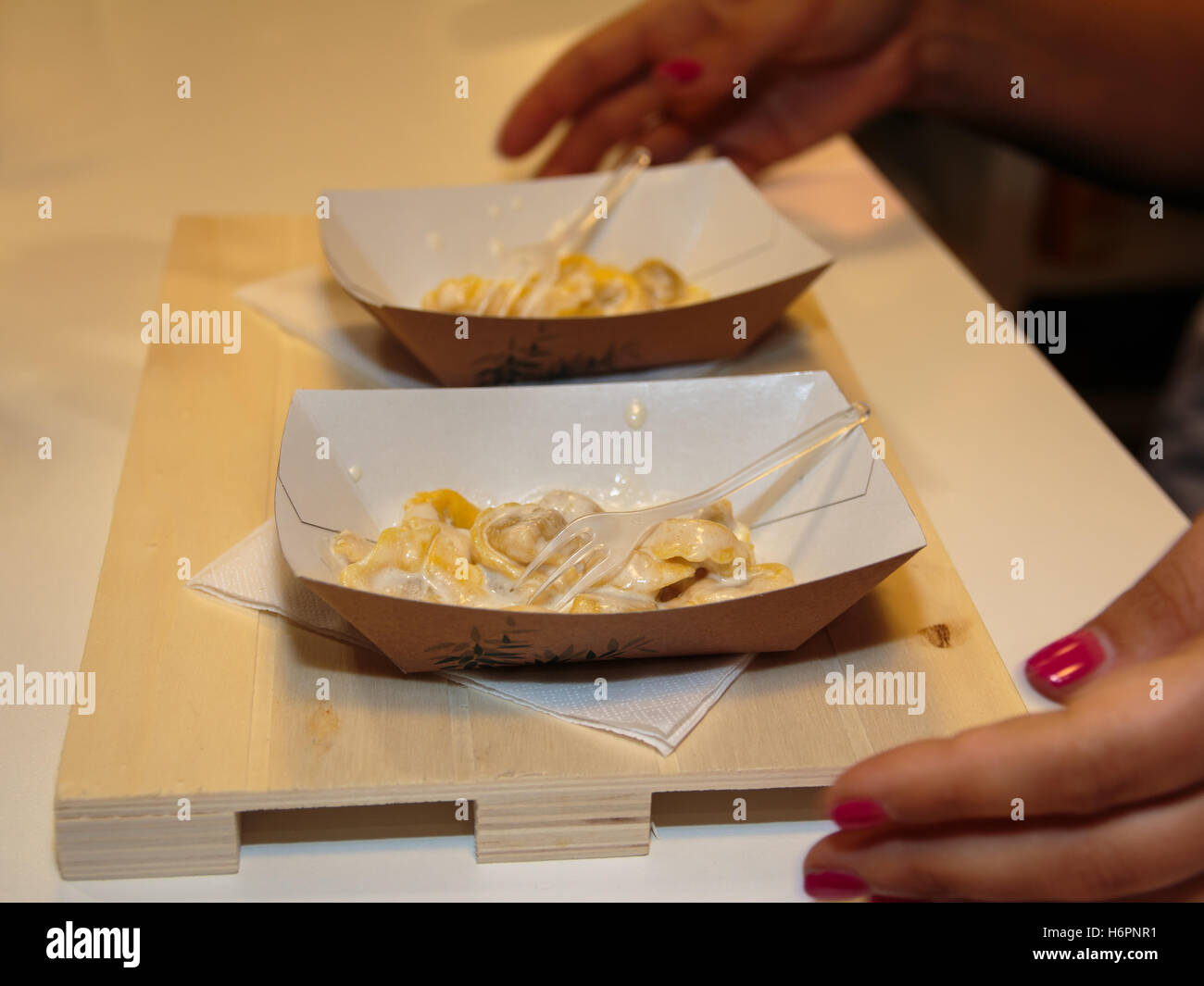 Tortellini Italian Pasta with Double Cream Sauce inside White Dishes ...