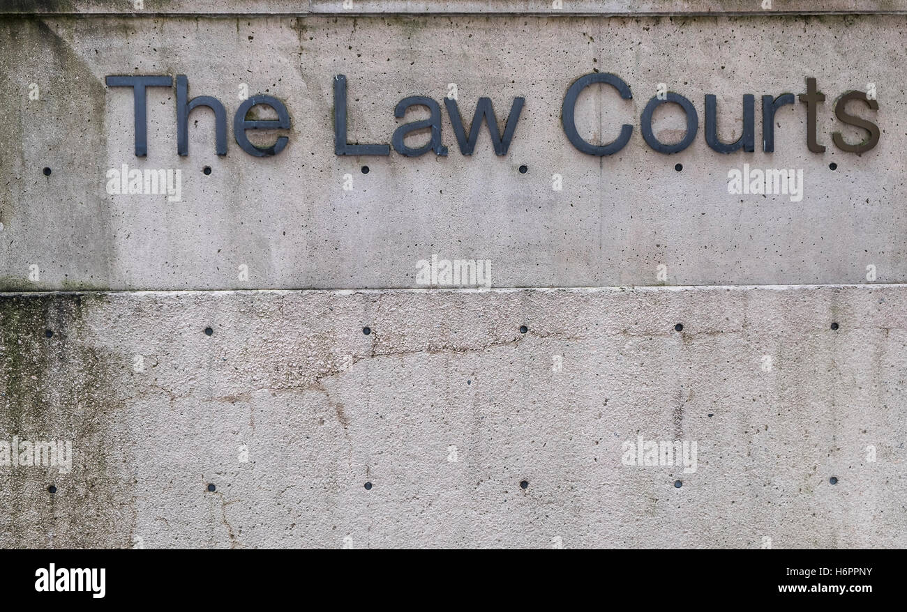 The Law Courts sign on a concrete wall outside a courthouse Stock Photo ...