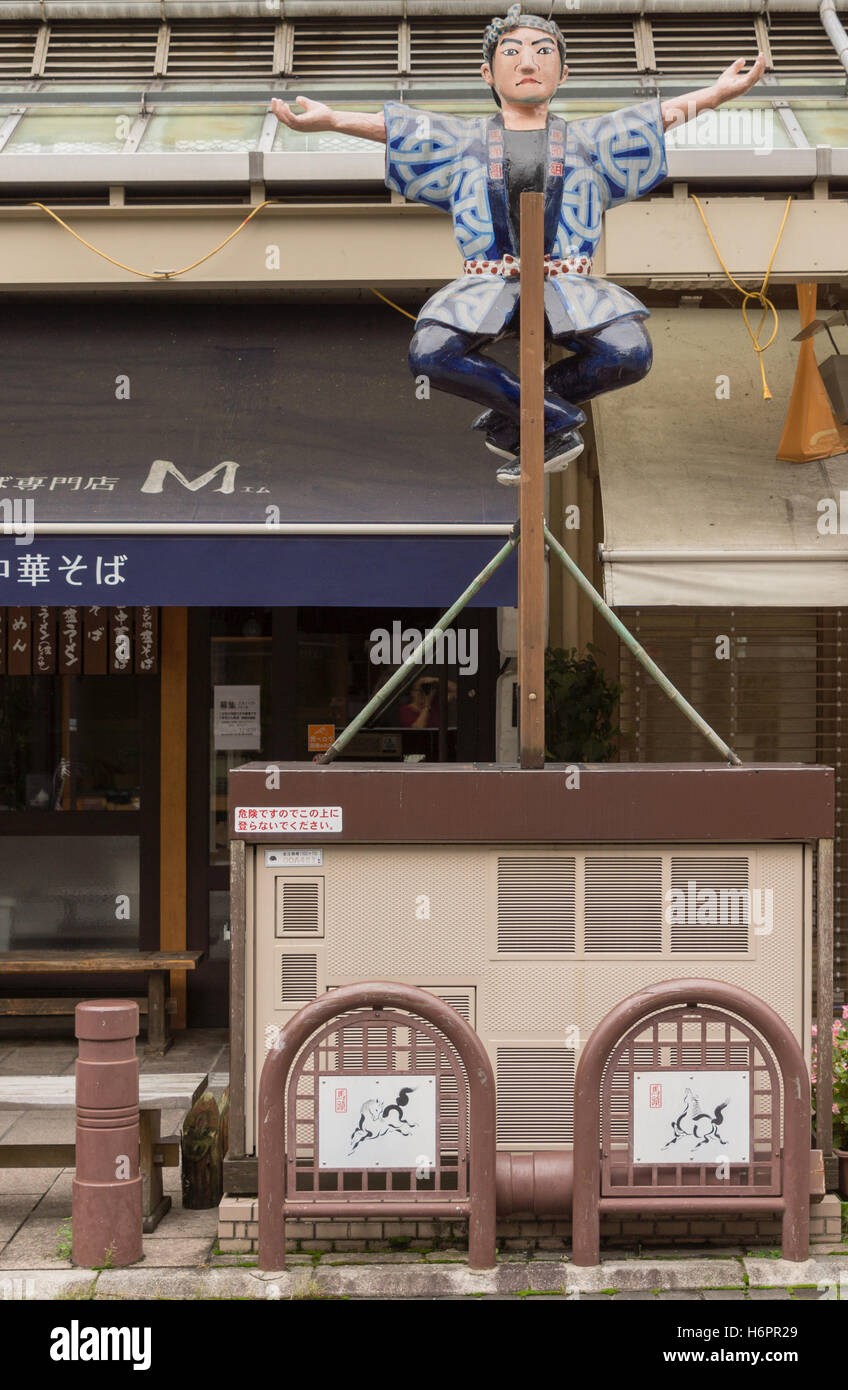 Japanese sushi Chef dummy hanging on a pole Stock Photo - Alamy