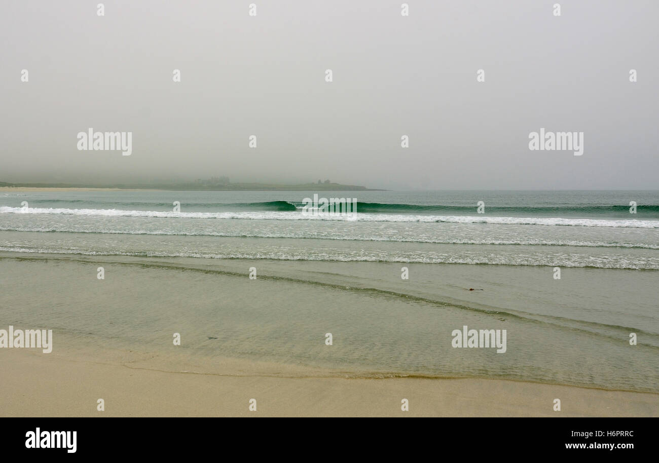 Waves on a sandy beach in the fog, Shetland Islands Stock Photo - Alamy