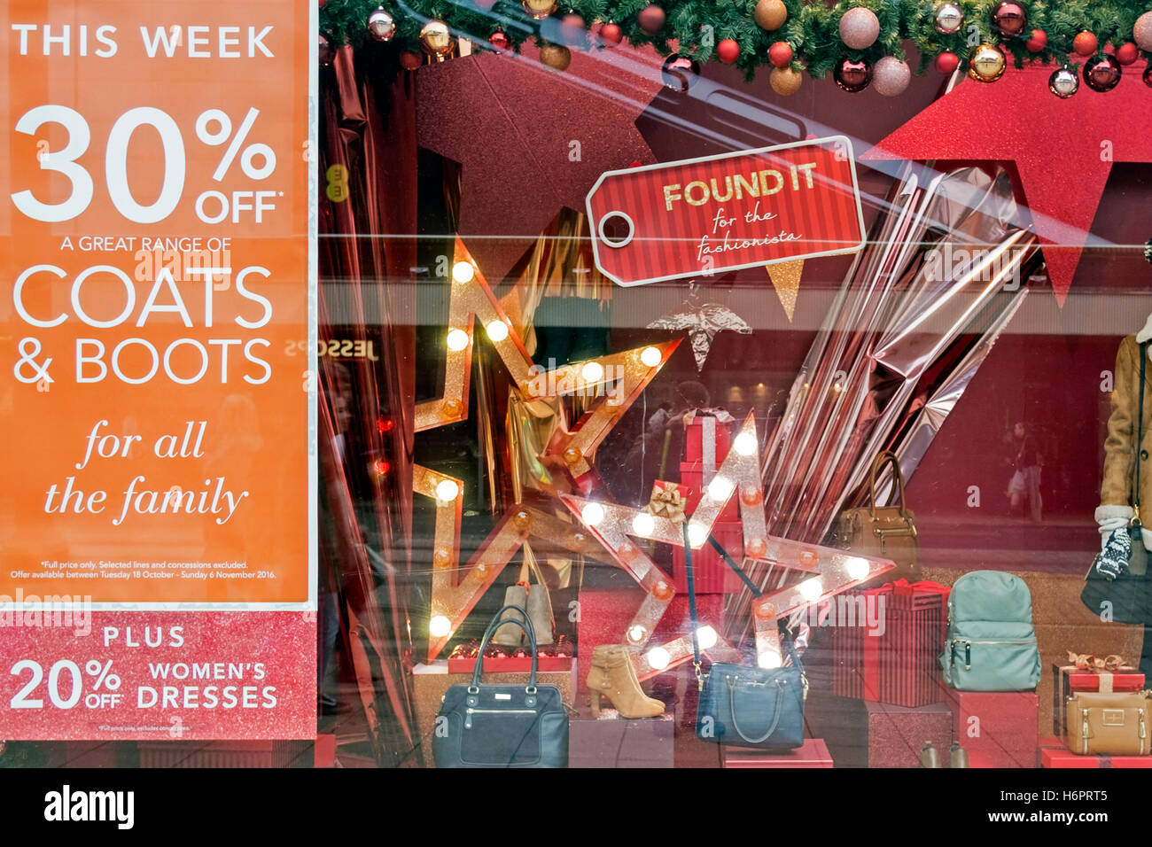 Shop windows with discount signs, Manchester UK Stock Photo - Alamy