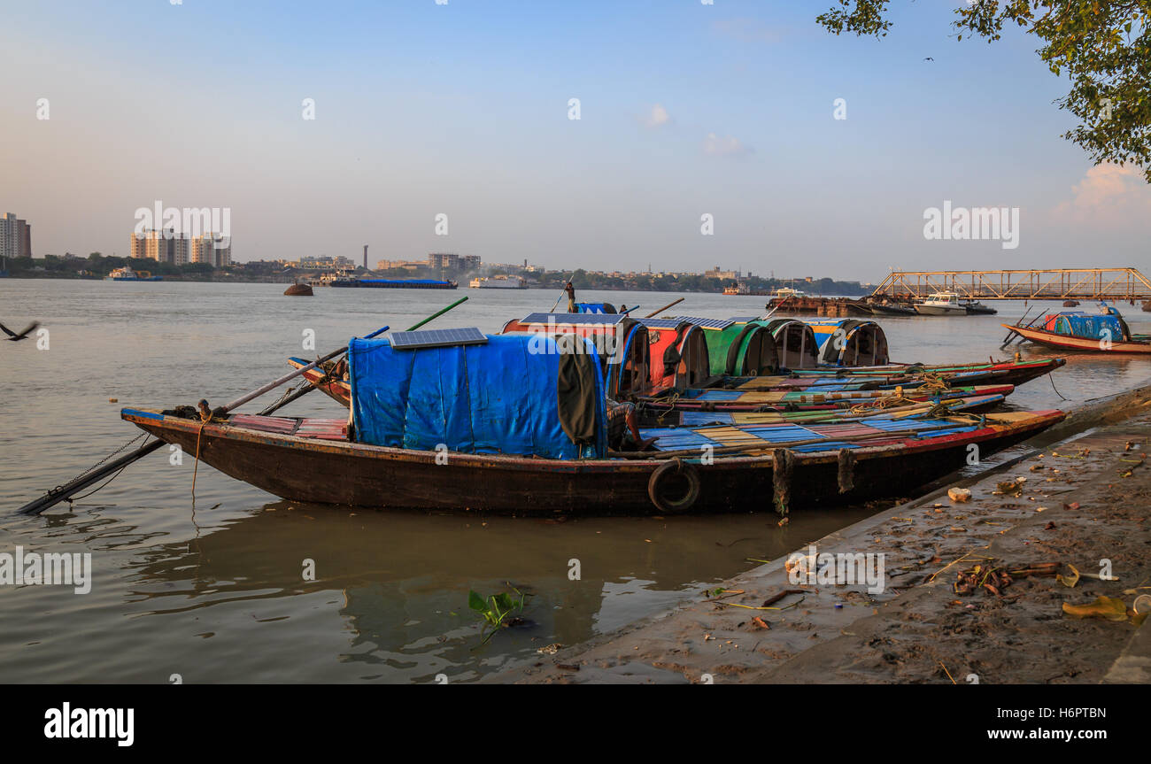 Wooden country boats used for pleasure boat rides on the Ganges river ...