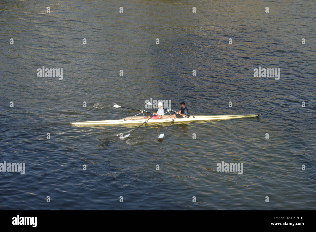 A Canoe on the Nile with 2 people rowing Stock Photo - Alamy
