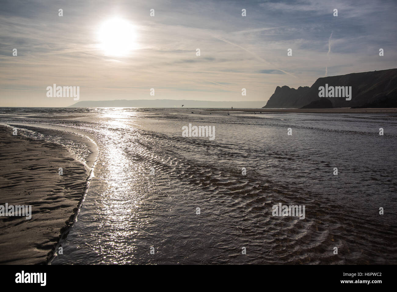 Pennard Pill river flows into the sea at Three Cliffs Bay, Gower, South ...